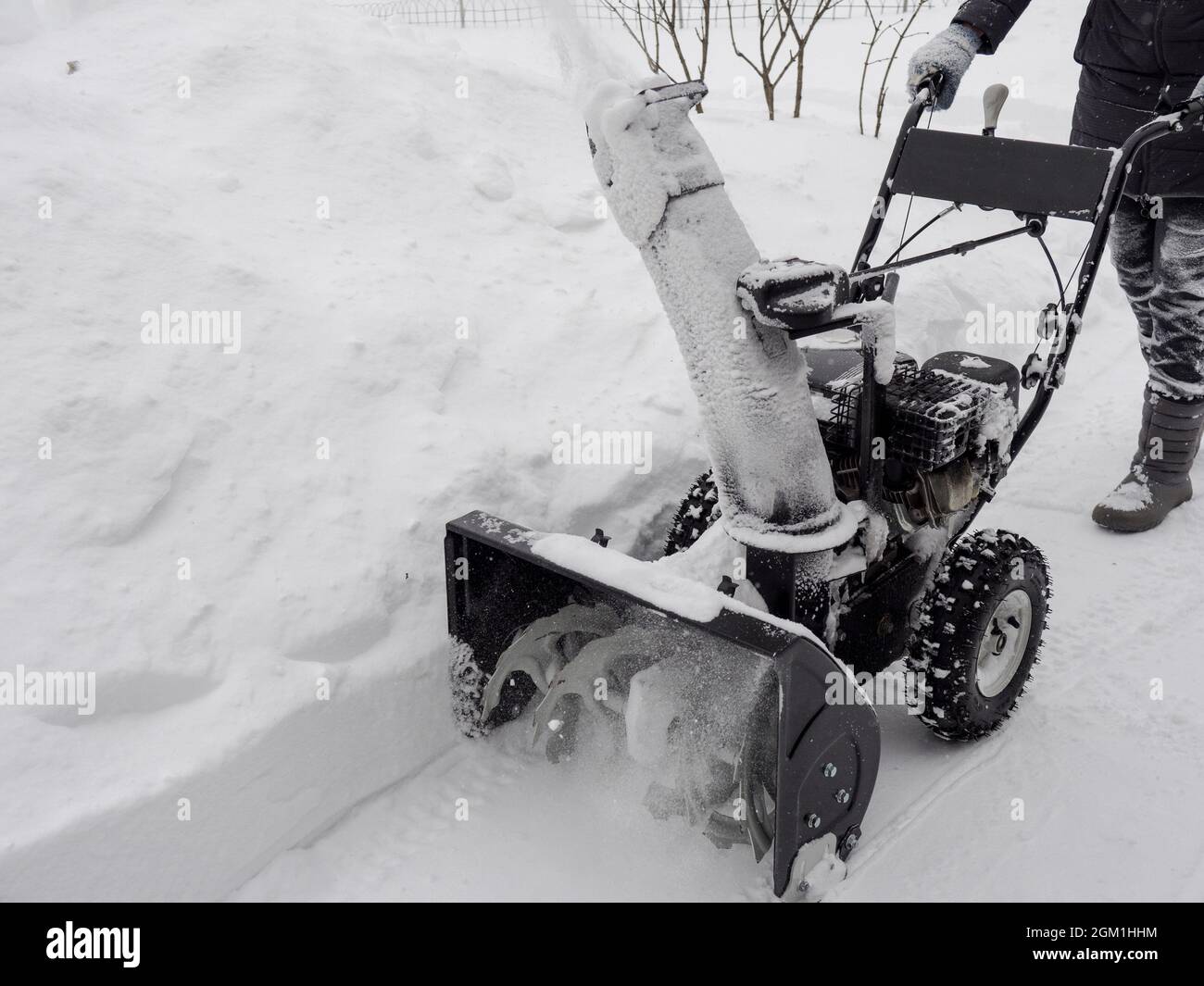 Clearing snow with a snowblower after a heavy snowfall Stock Photo - Alamy