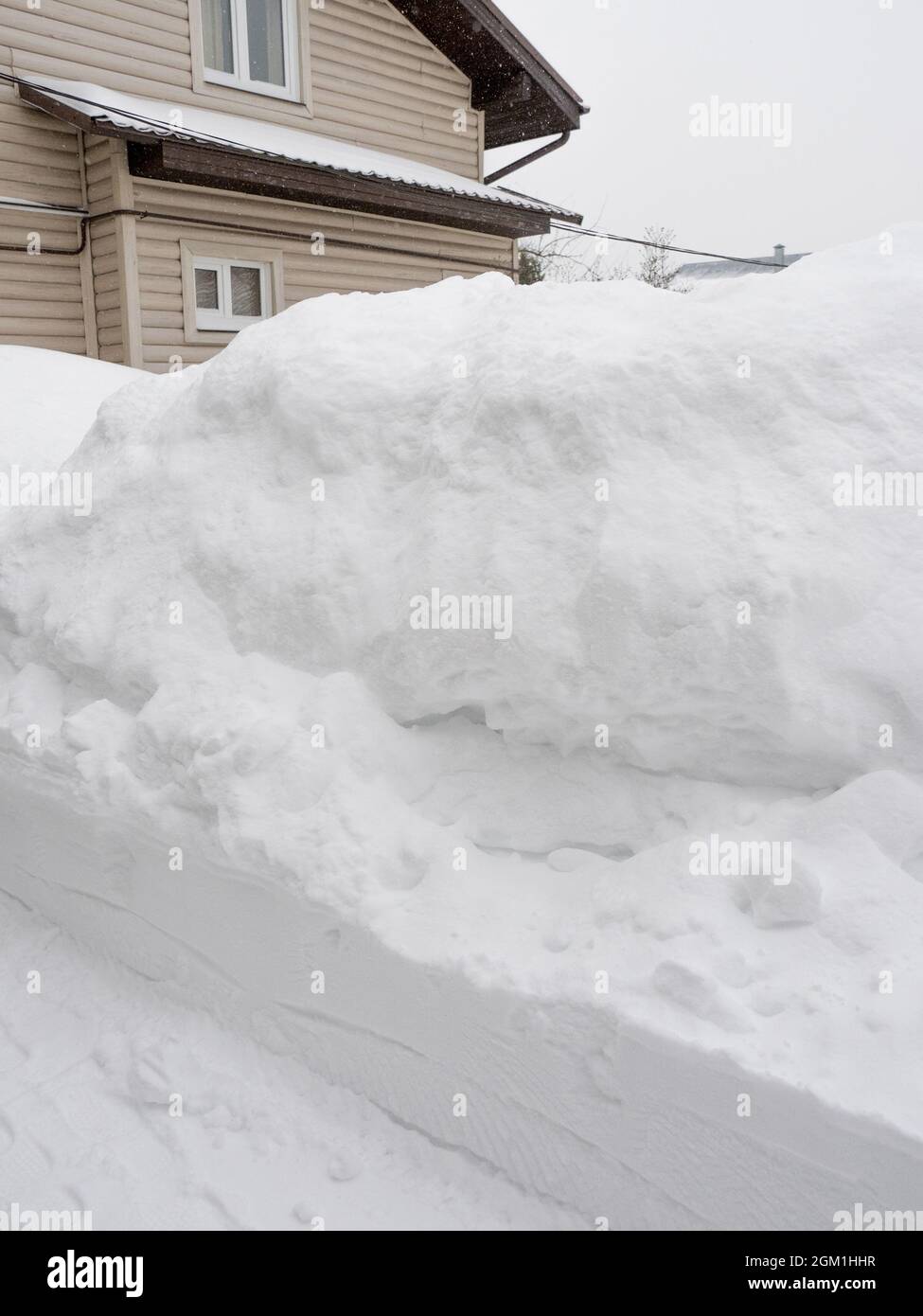 Huge heap of snow in front of the house after a heavy snowfall Stock ...