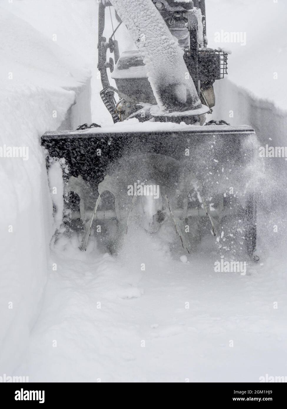 Clearing snow with a snowblower after a heavy snowfall Stock Photo - Alamy