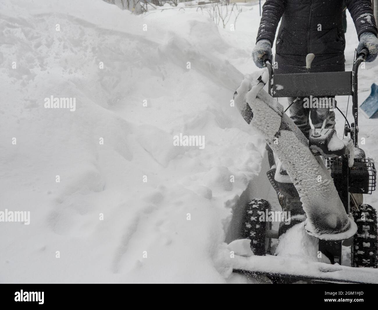 Clearing snow with a snowblower after a heavy snowfall Stock Photo - Alamy