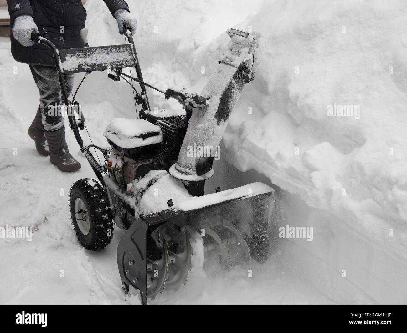 Clearing snow with a snowblower after a heavy snowfall Stock Photo - Alamy