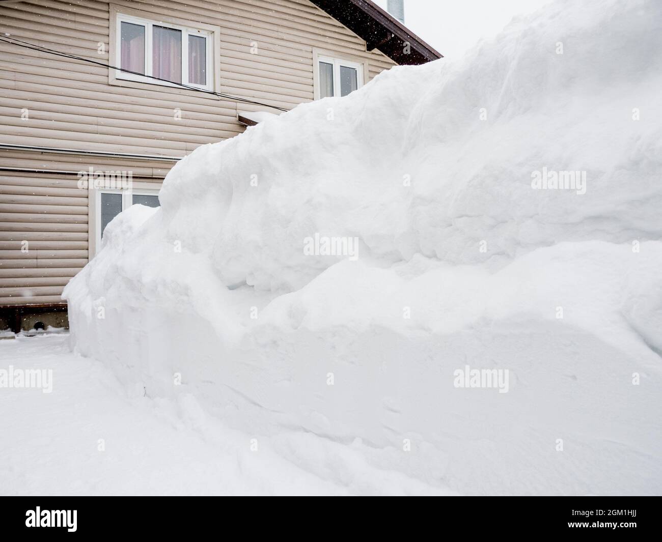Huge heap of snow in front of the house after a heavy snowfall Stock ...