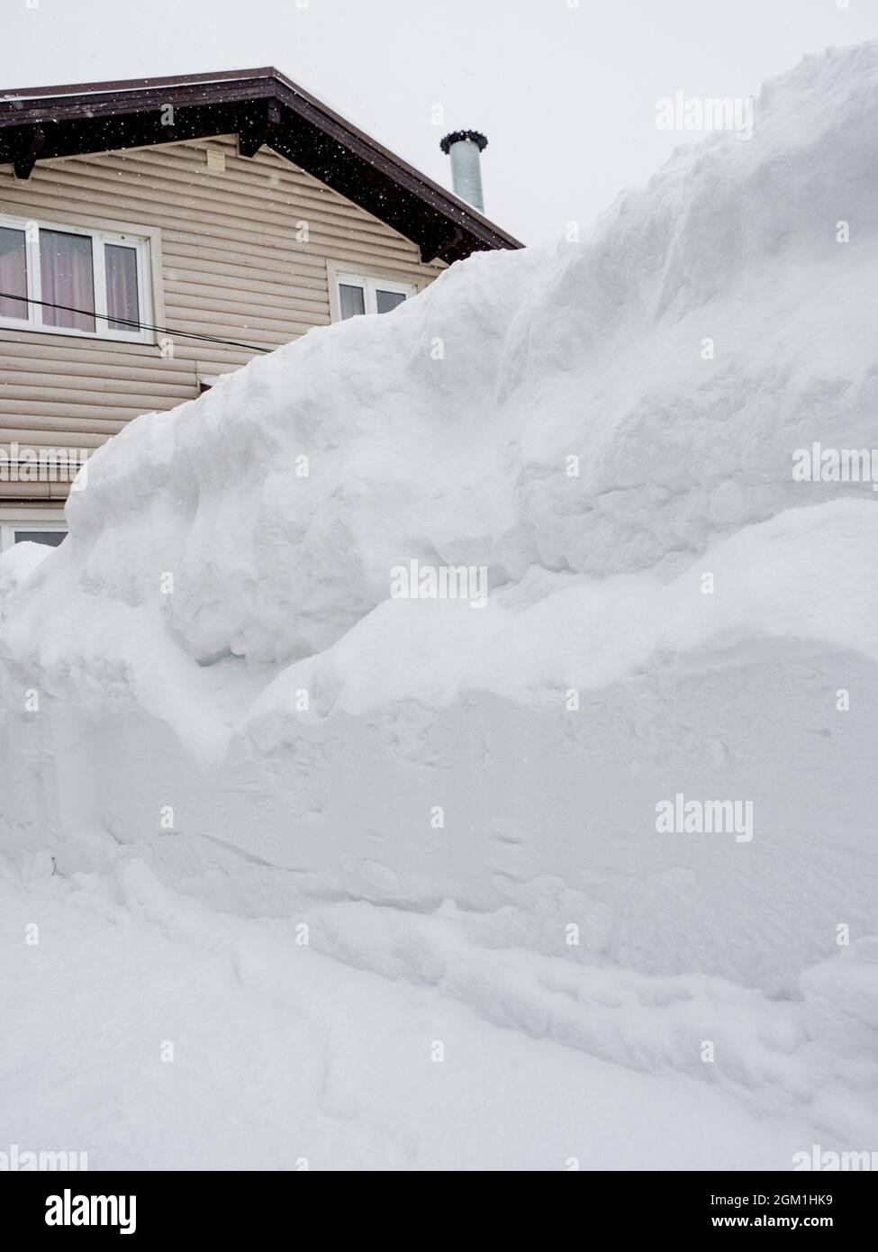 Huge heap of snow in front of the house after a heavy snowfall Stock ...