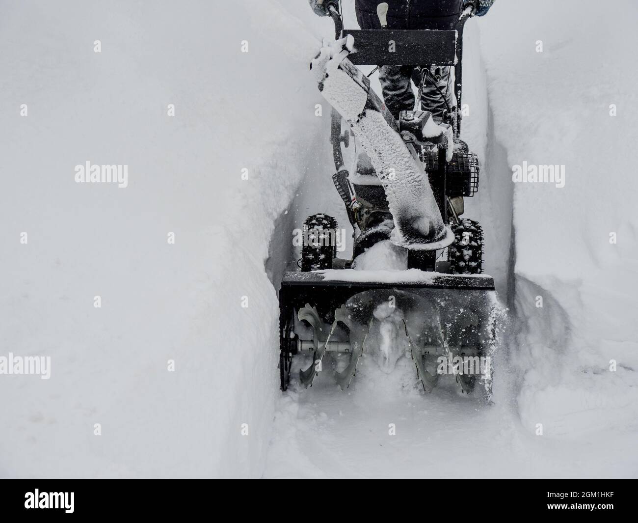 Clearing snow with a snowblower after a heavy snowfall Stock Photo - Alamy