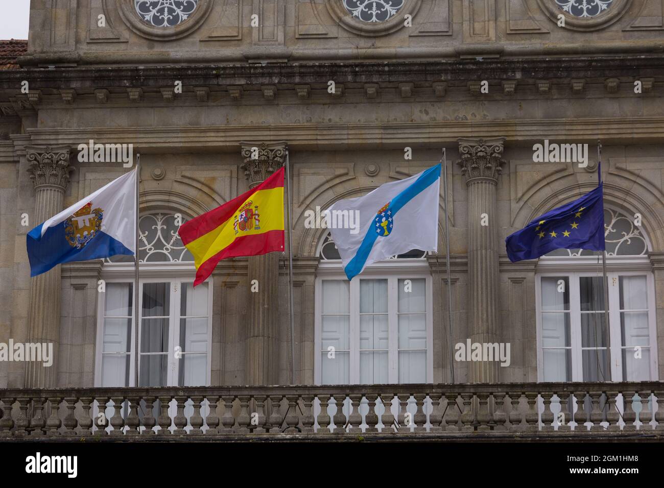 diversity of Flags in movement on the balcony of an official organism ...