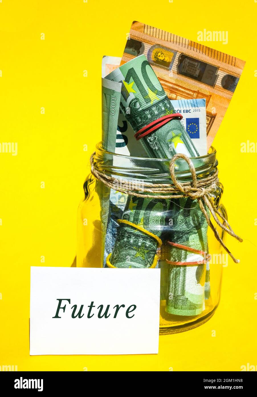 Glass jars filled with Euro bills, savings inside glass jar, money ...