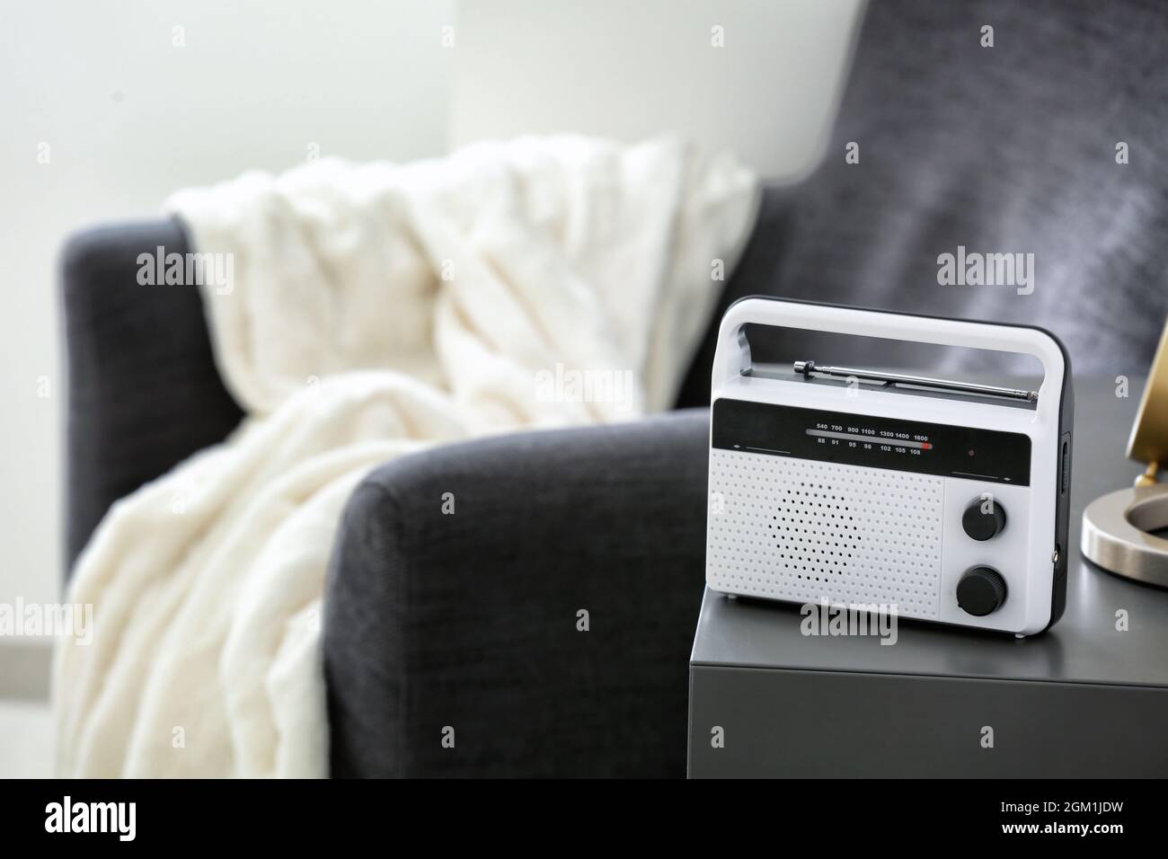 Modern radio receiver on table in room Stock Photo - Alamy