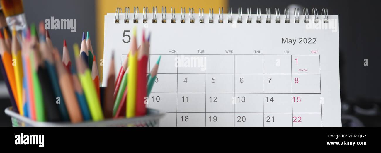 Calendar for May with colored pencils is on table Stock Photo - Alamy