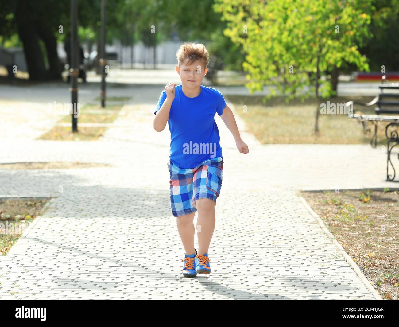 Child fat running hi-res stock photography and images - Alamy