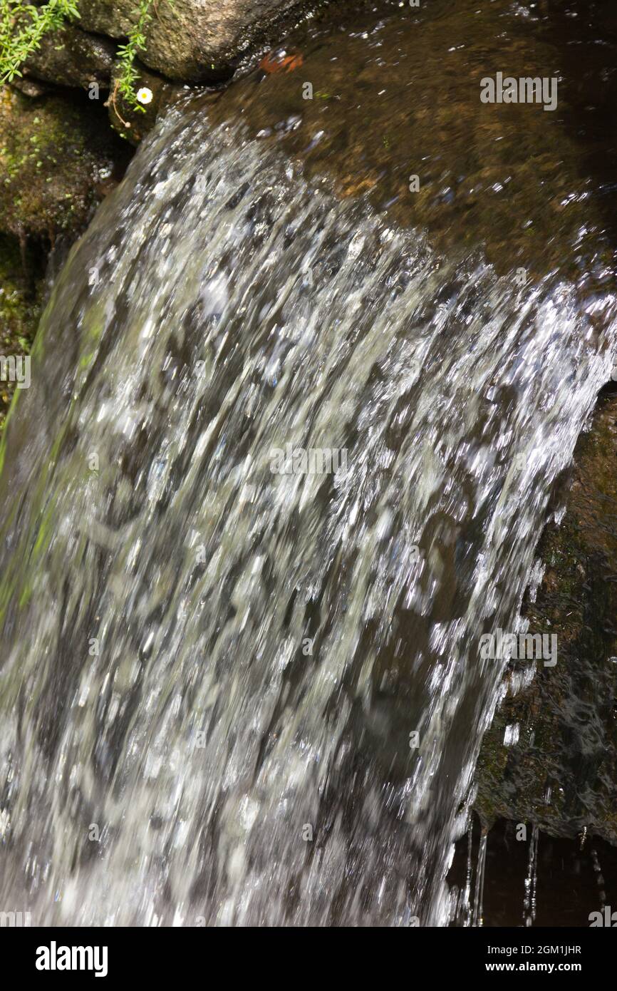 Small waterfalls; waterfalls. Nature. Foam generated by the waterfall ...