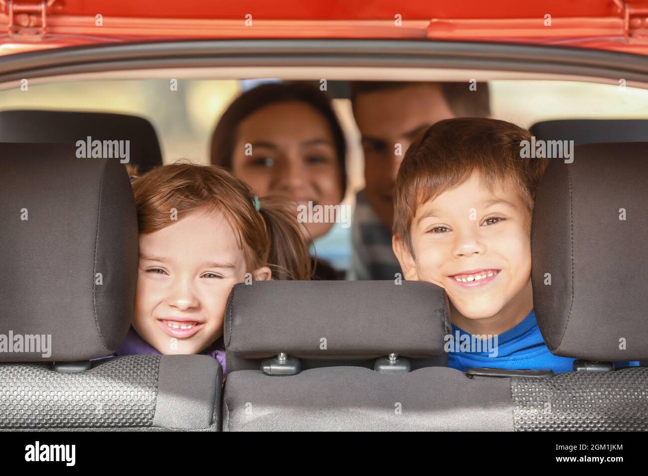 Happy family in modern car Stock Photo - Alamy