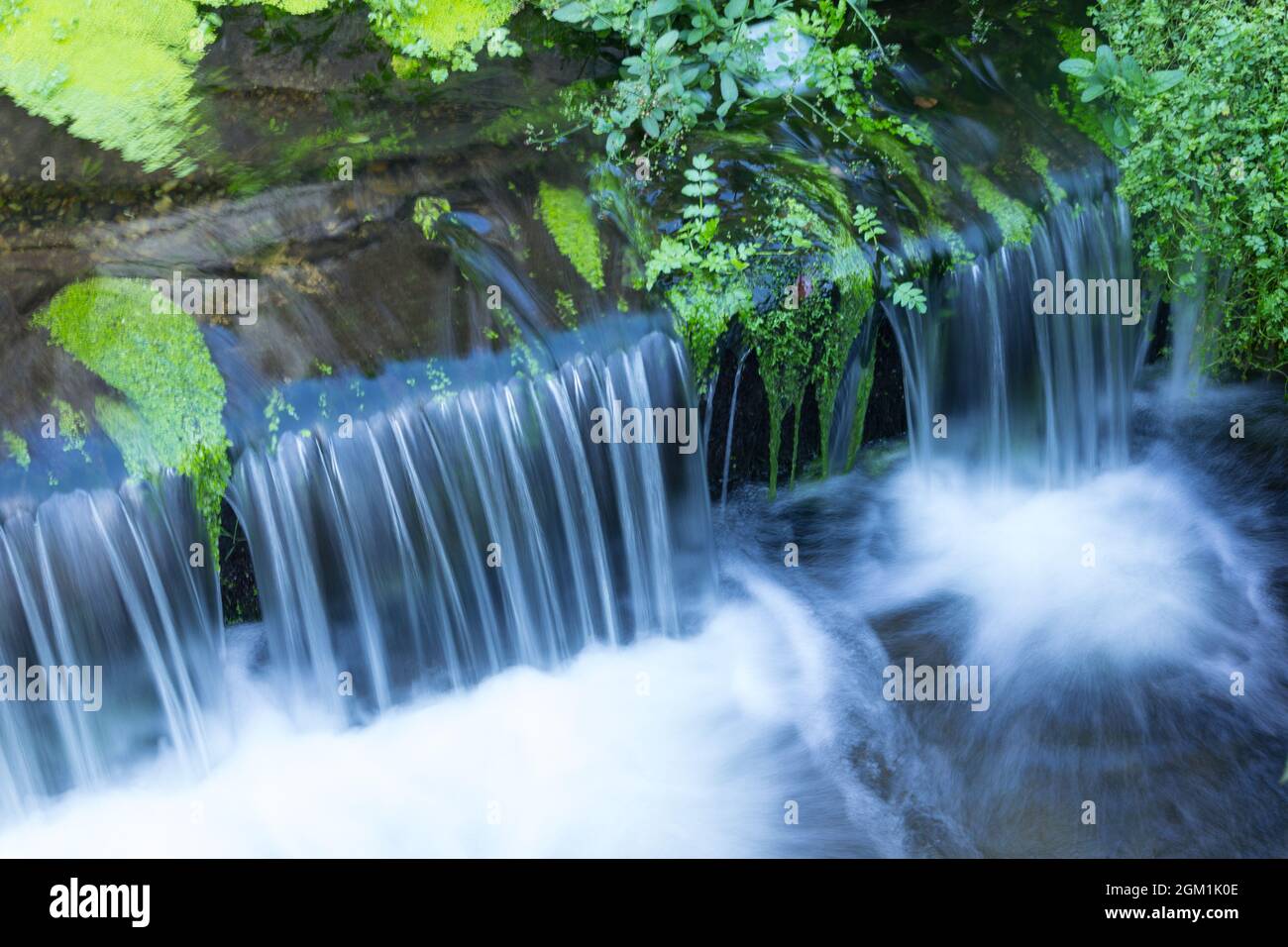 Small waterfalls; waterfalls. Nature. Foam generated by the waterfall ...