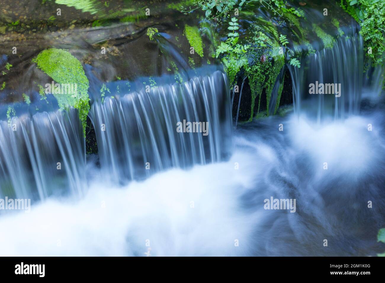 Small waterfalls; waterfalls. Nature. Foam generated by the waterfall ...
