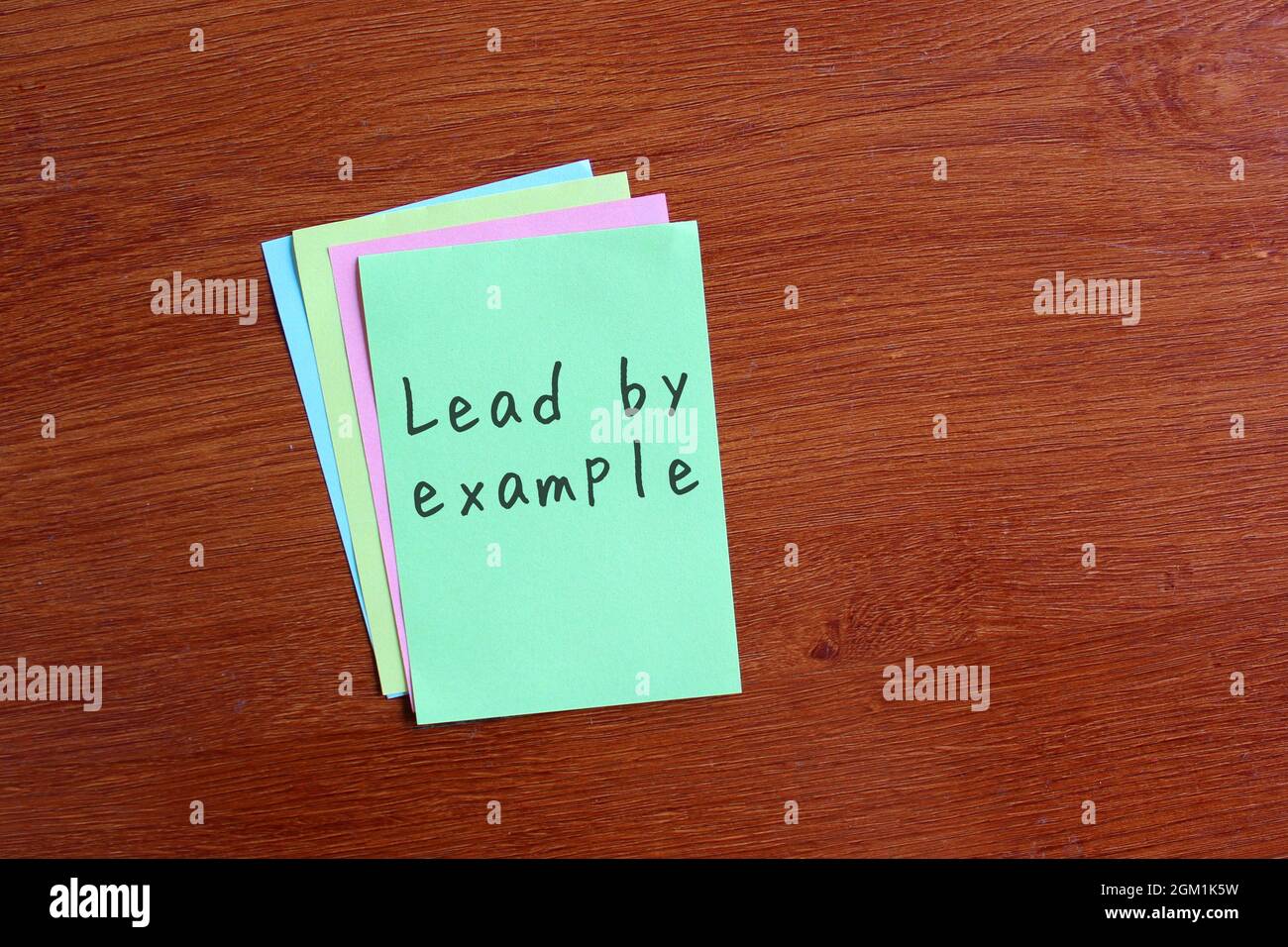 Motivational quotes concept. Lead by example written on notepaper Stock ...