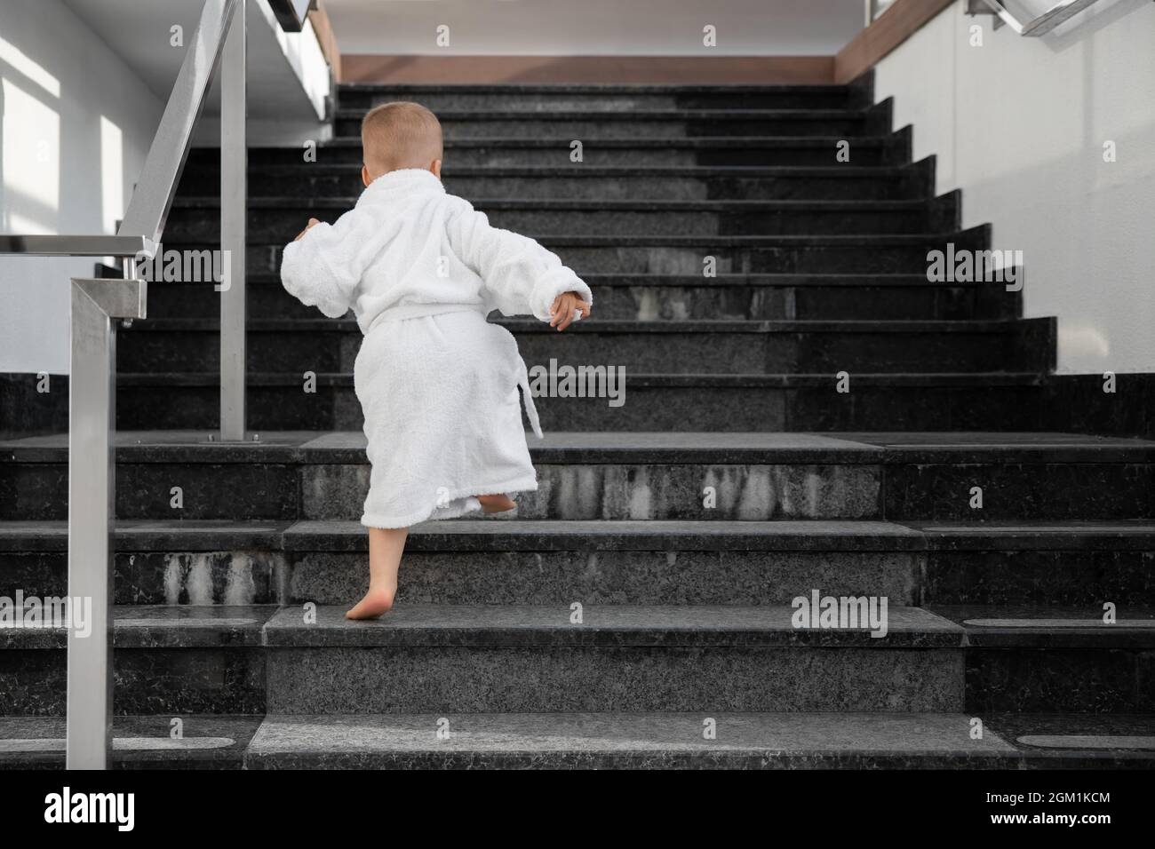 Boy running up stairs hi-res stock photography and images - Alamy