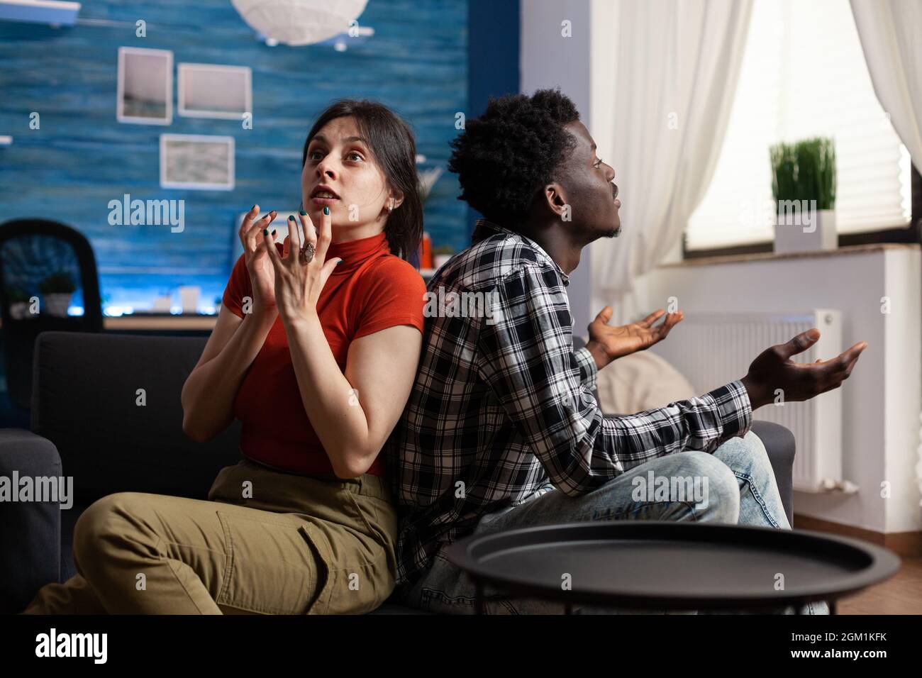 Interracial Couple Screaming While Sitting On Sofa Angry Mixed Race