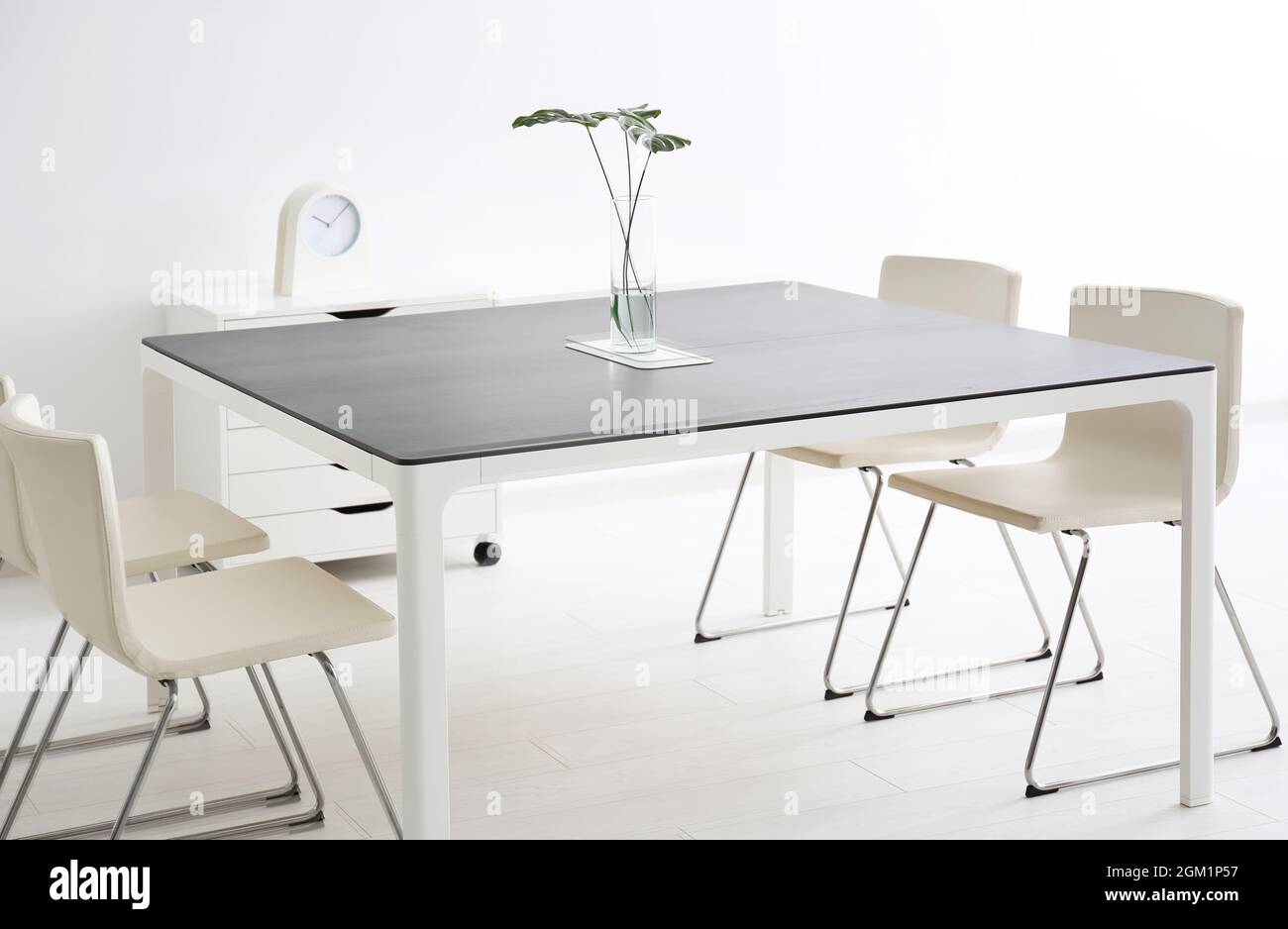 Modern office interior with big table and white chairs Stock Photo - Alamy