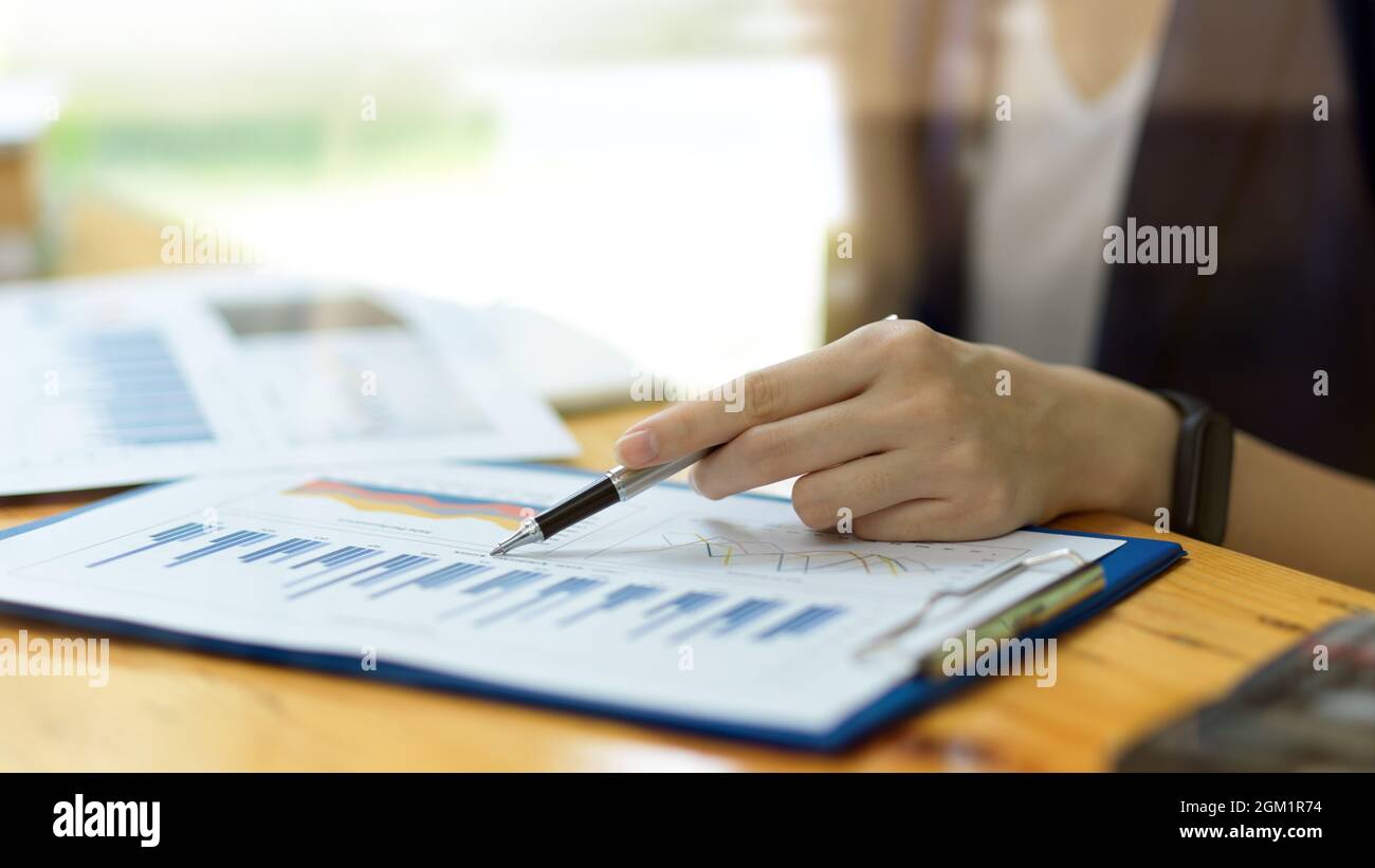 Company female auditor working in office, looking and checking business ...