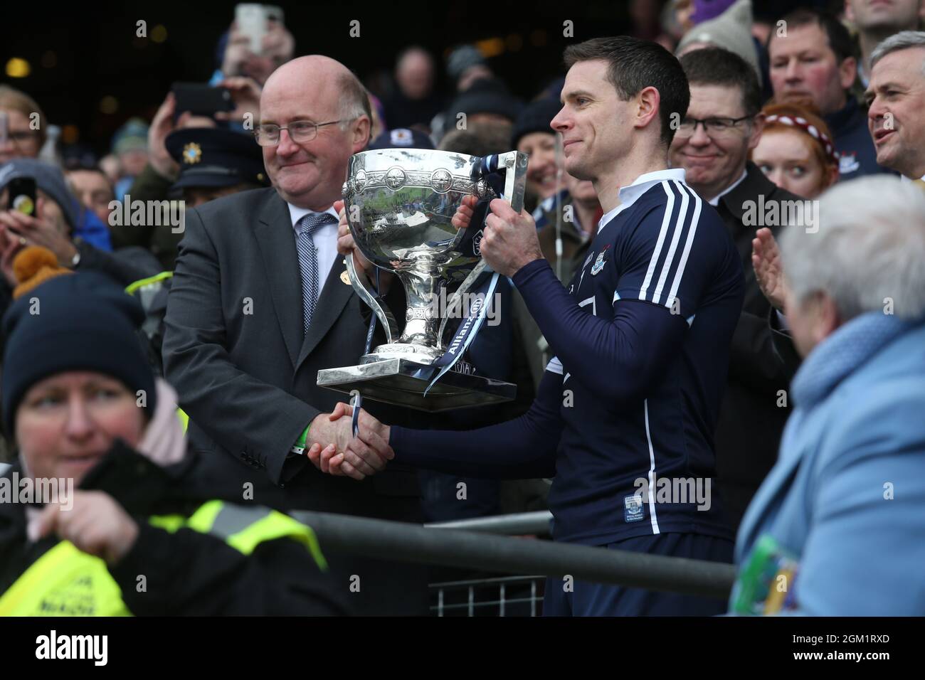 Stephen Cluxton accepts the trophy after the Gaelic Football National ...