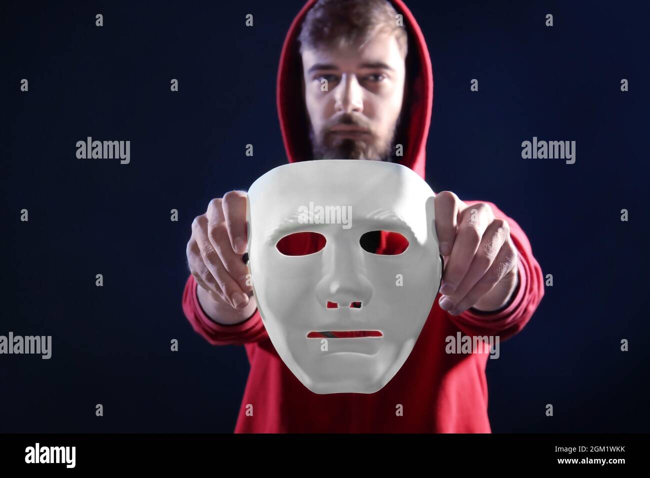 Hacker with mask in darkness Stock Photo - Alamy