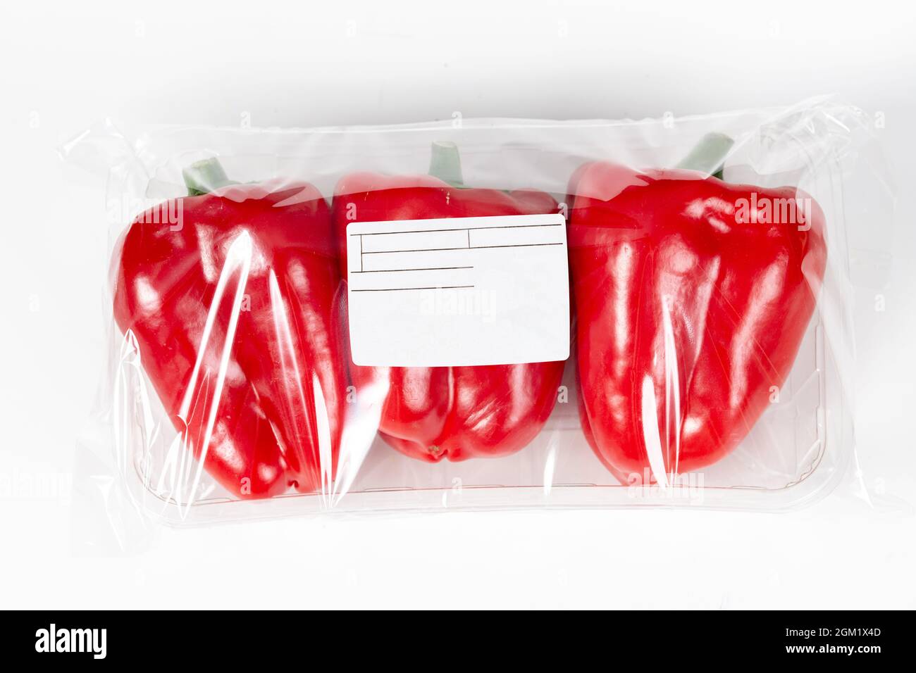 3 red bell pepper packed and labeled on white background Stock Photo ...