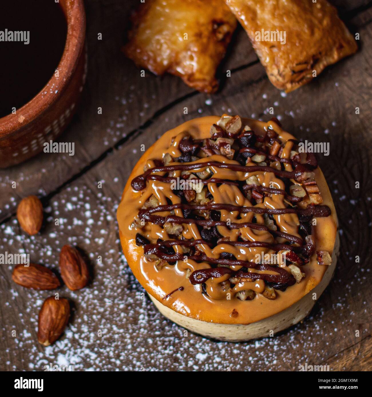 Vertical shot of a fresh pie with syrups and nuts Stock Photo - Alamy