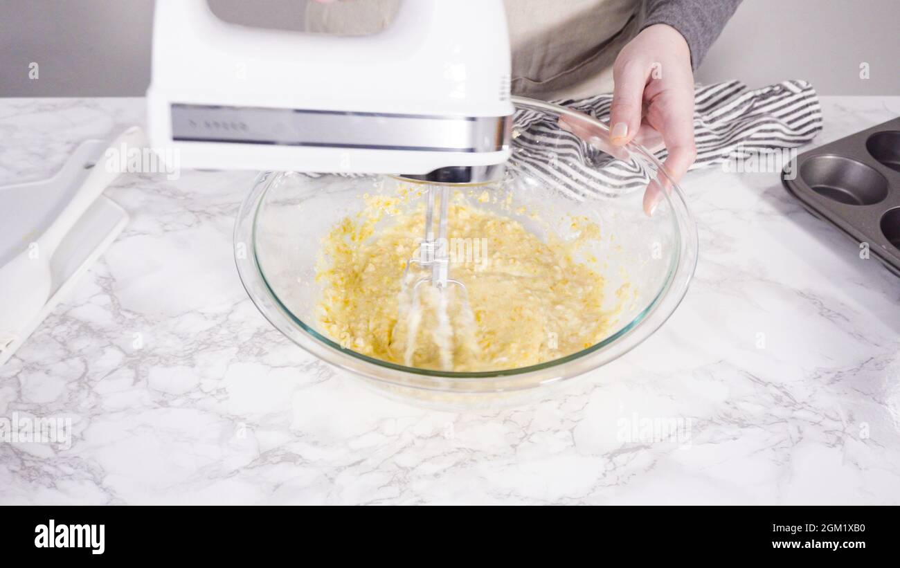 Step by step. Mixing ingredients in a mixing bowl to bake cranberry ...