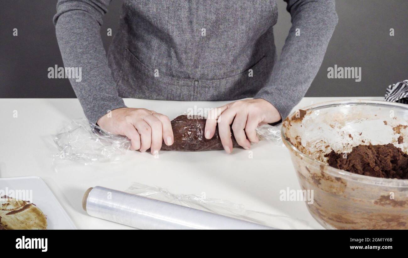 Step by step. Wrapping cookie dough into the plastic wrap to bake ...