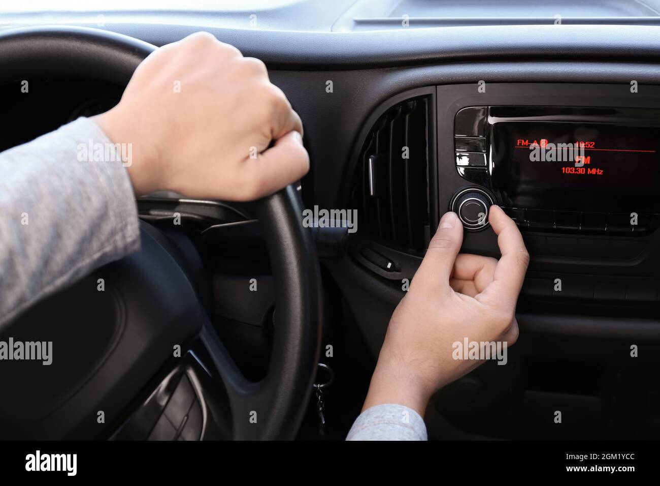 Man tuning car radio, closeup Stock Photo - Alamy