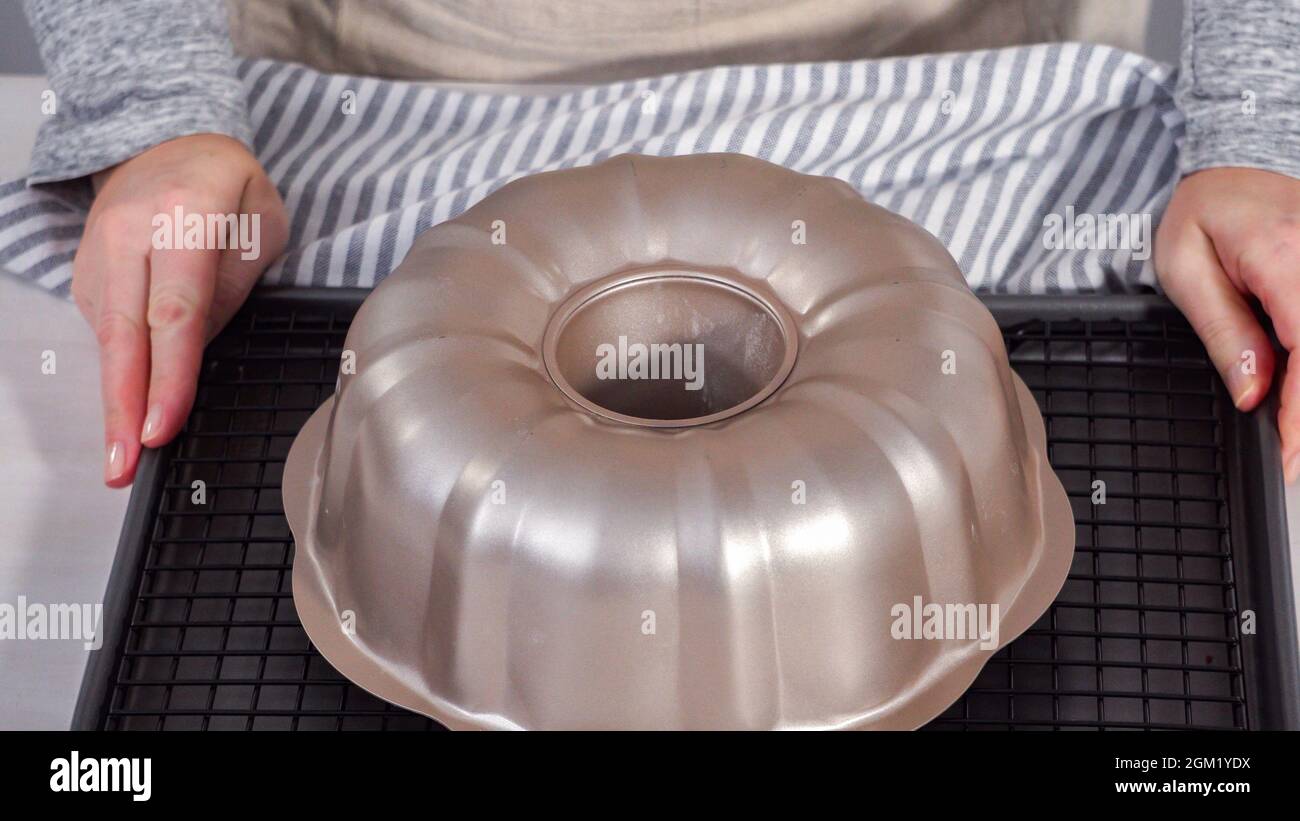 Step by step. Cooling freshly baked chocolate bundt cake on a cooling ...