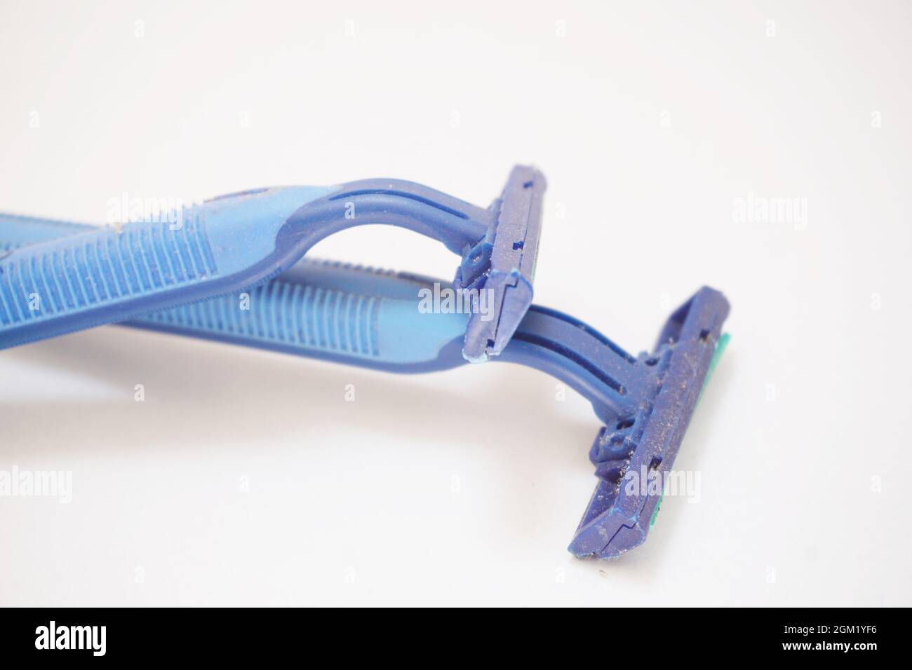 Moustache and beard shaver with used razor blade on an isolated white ...