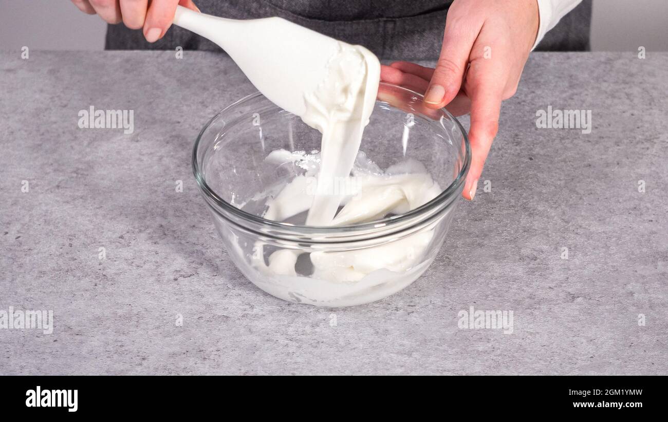 Step by step. Mixing ingredients in a glass mixing bowl to prepare the ...