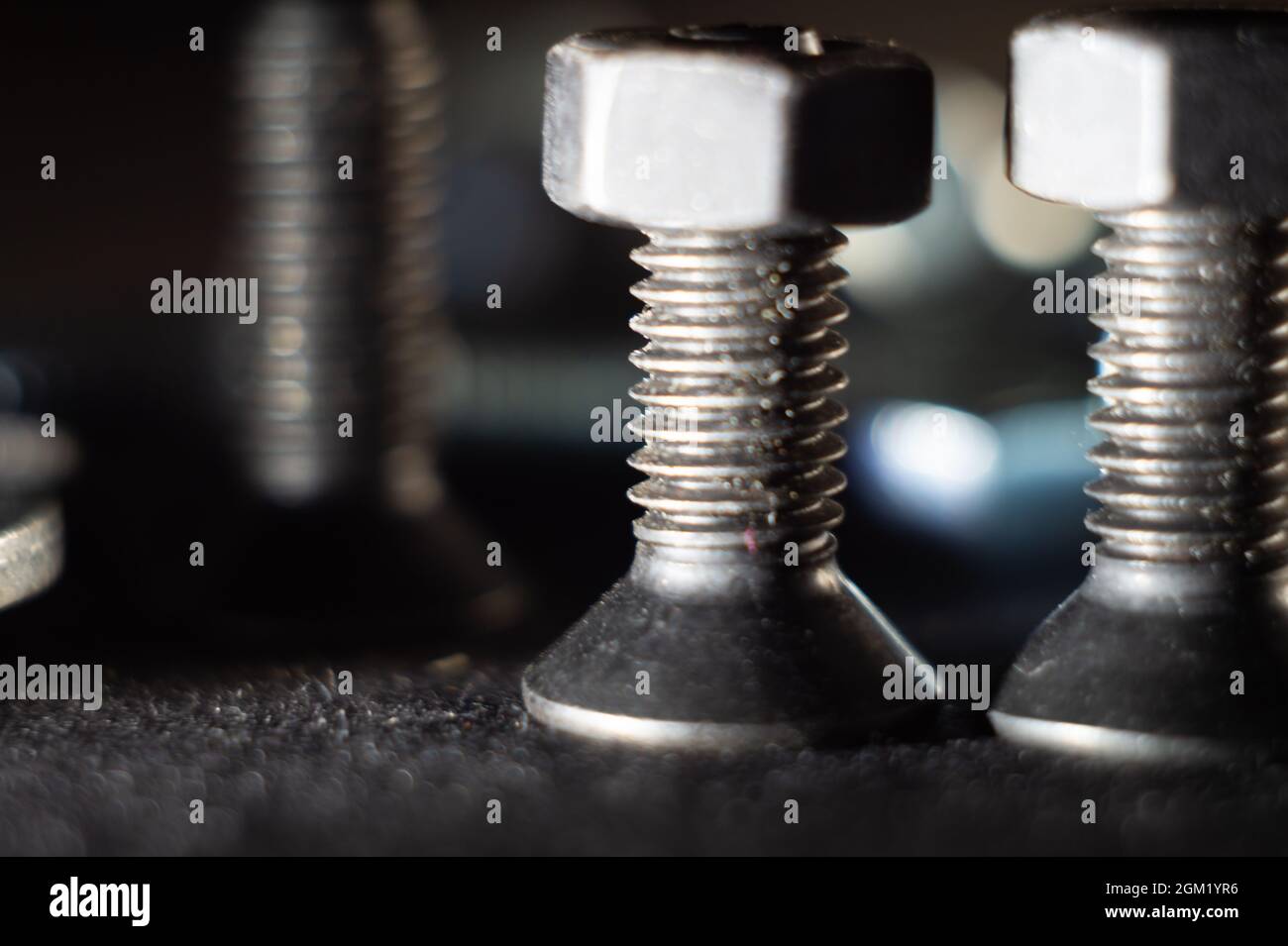 Closeup of the details of the bolts. Bolts and hex nuts Stock Photo - Alamy