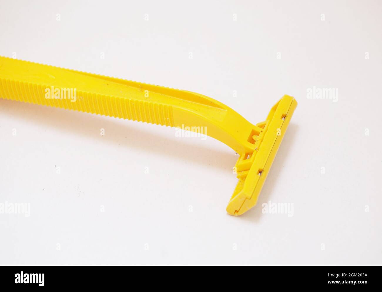 Moustache and beard shaver with used razor blade on an isolated white ...