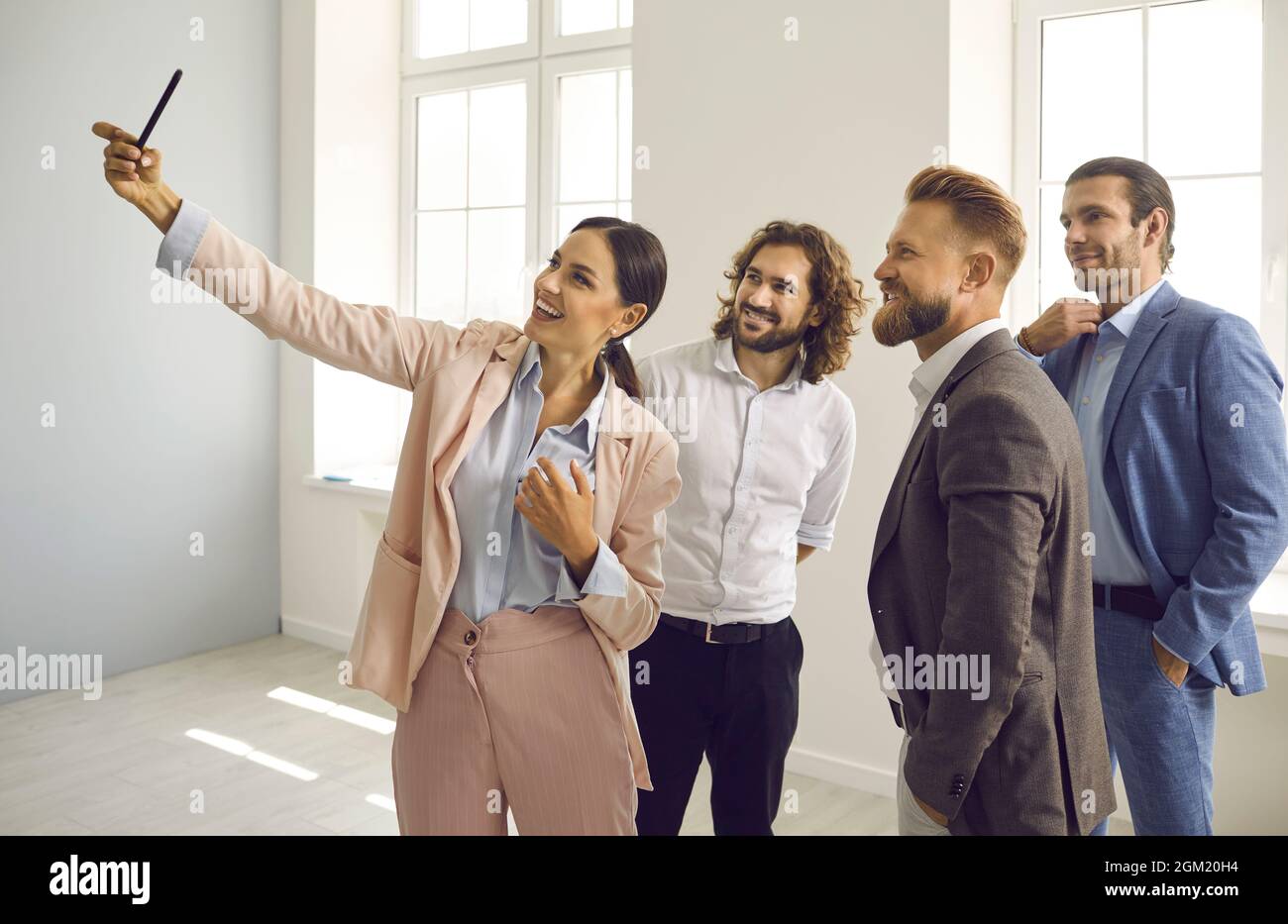 Smiling diverse employees take self-portrait picture on cell Stock ...