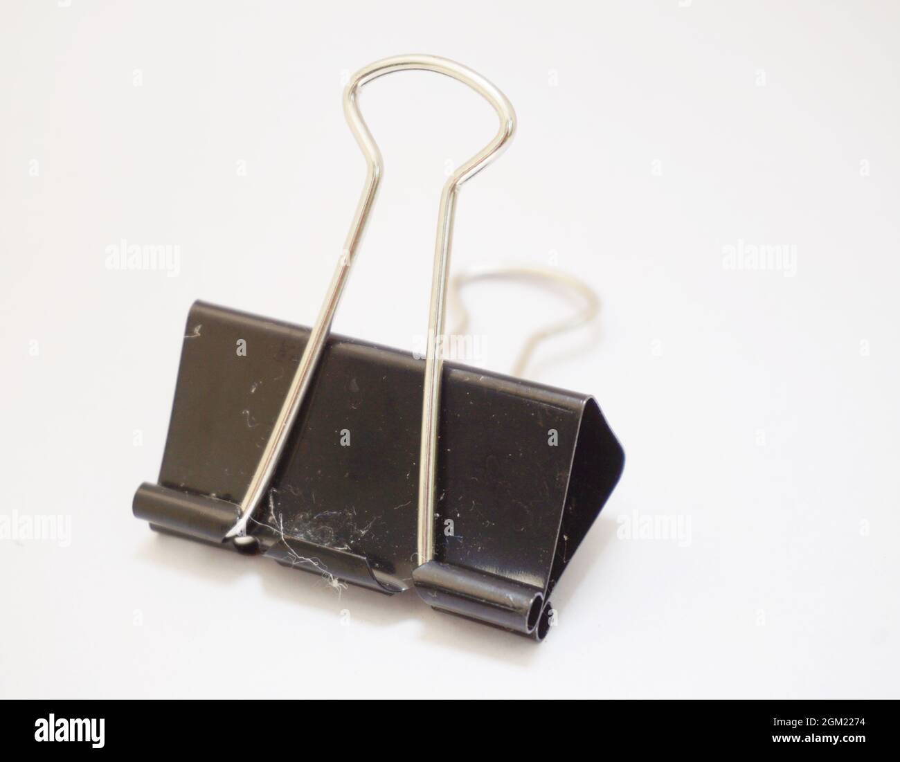 Isolated used paper clip on white background Stock Photo - Alamy
