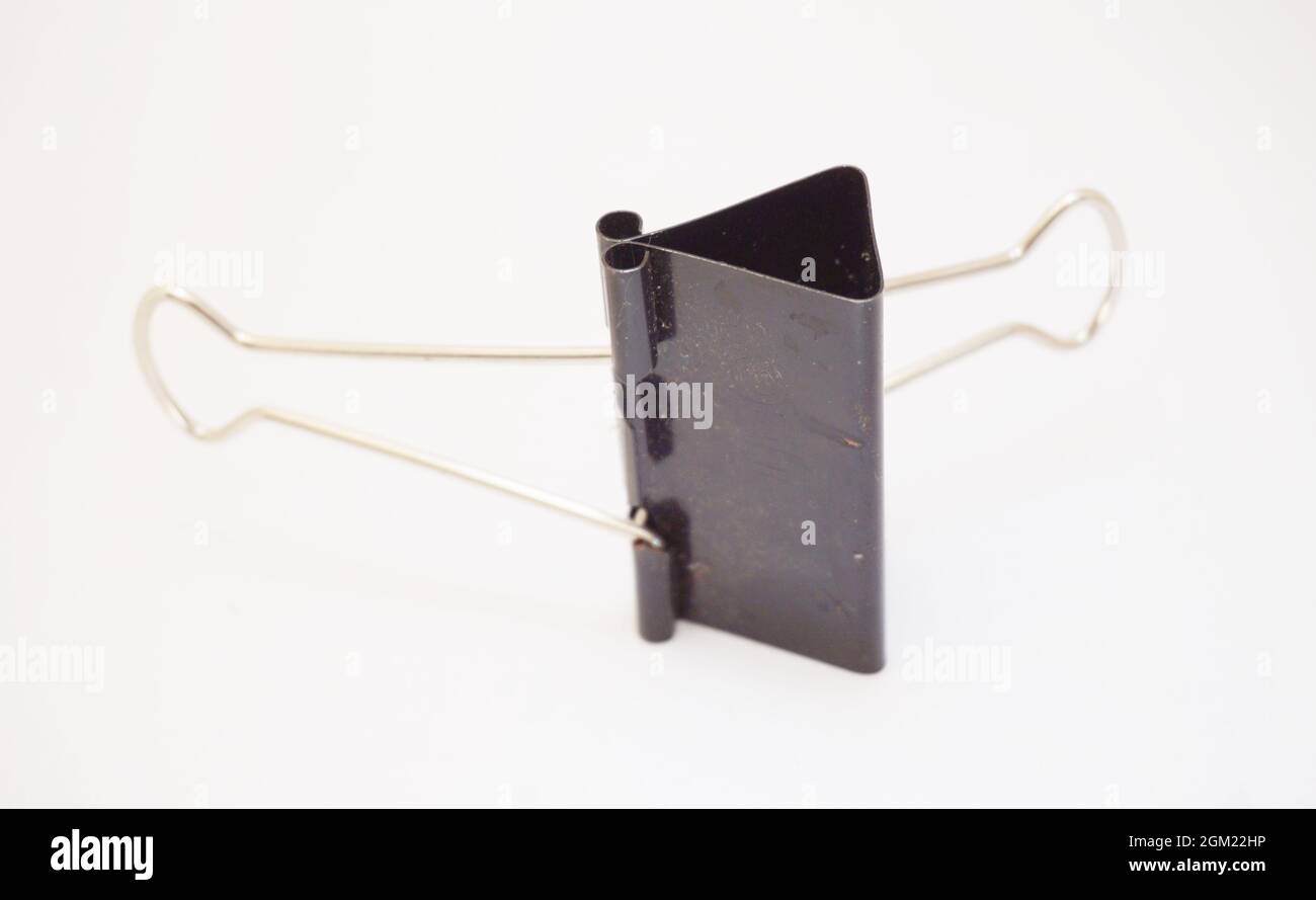 Isolated used paper clip on white background Stock Photo - Alamy