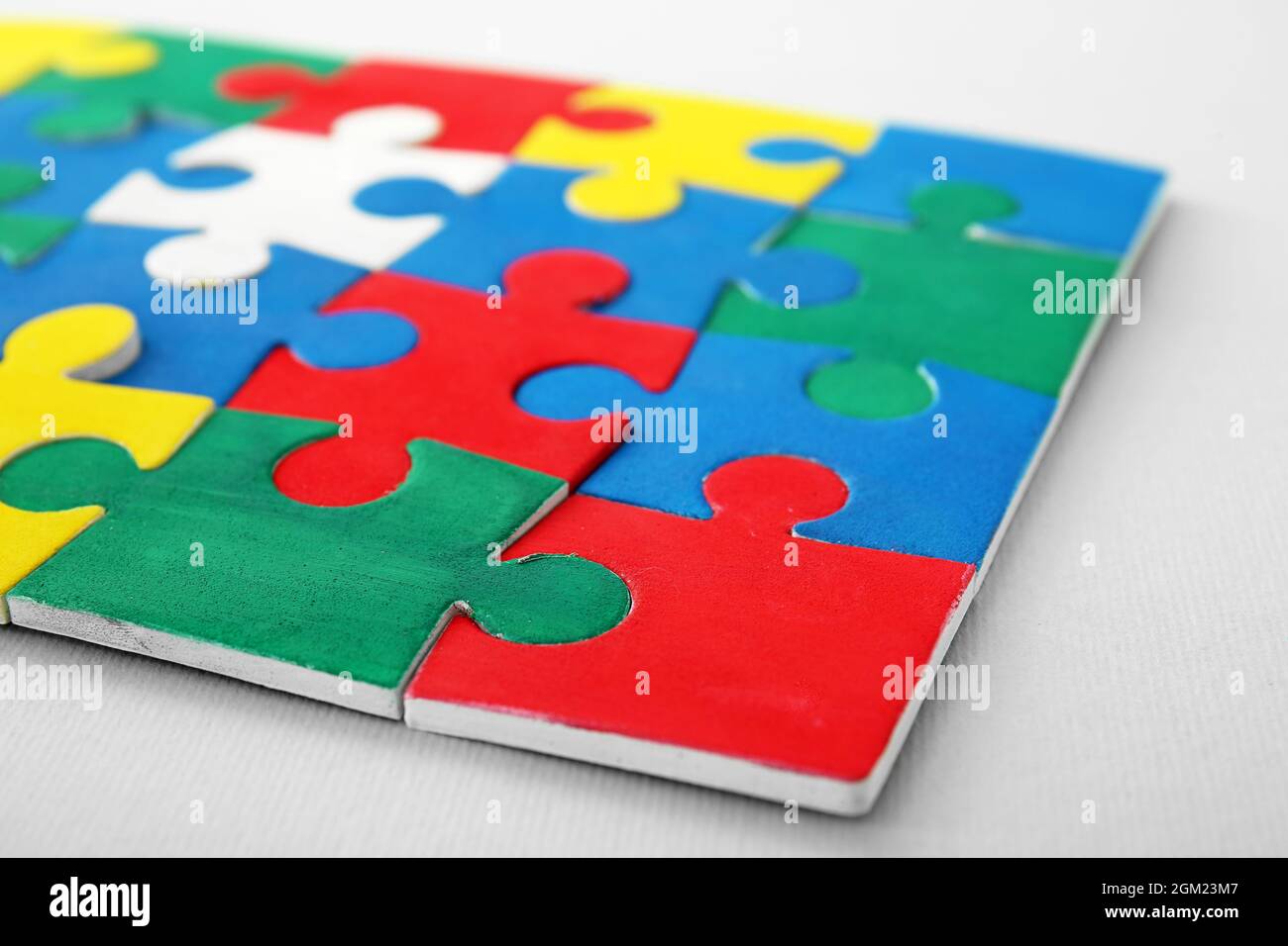 Color puzzle on light background Stock Photo - Alamy