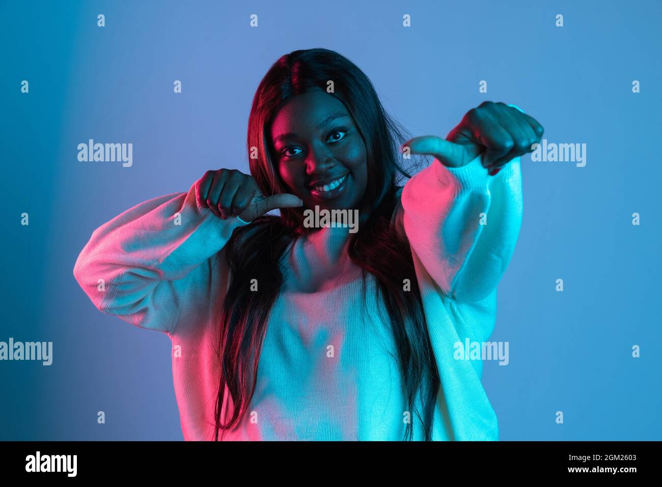 One joyful African beautiful woman with long straight hair singing ...