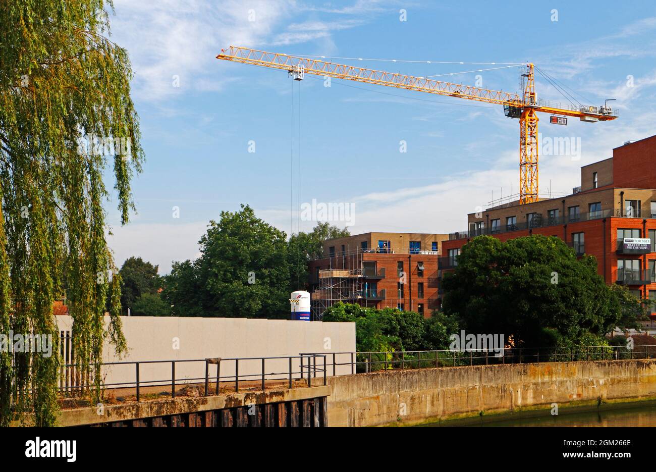 Crane near buildings in heavy hi-res stock photography and images - Alamy
