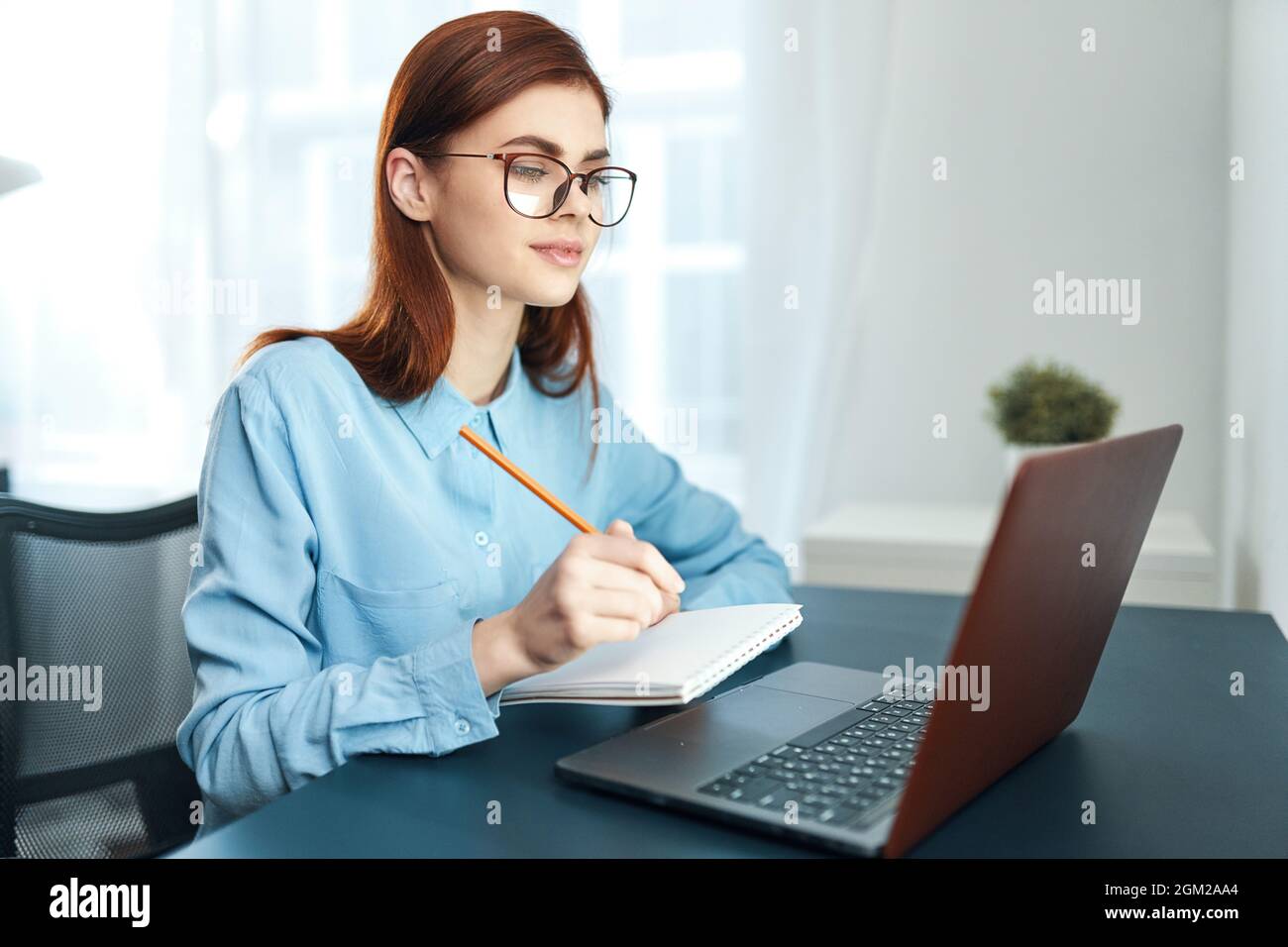 woman student in front of laptop learning fatigue Stock Photo - Alamy