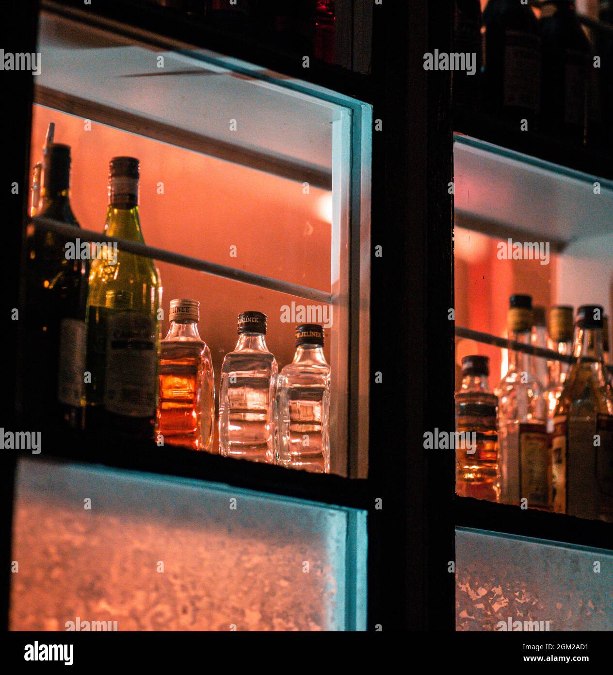 Flask inside an old window with warm colors Stock Photo - Alamy