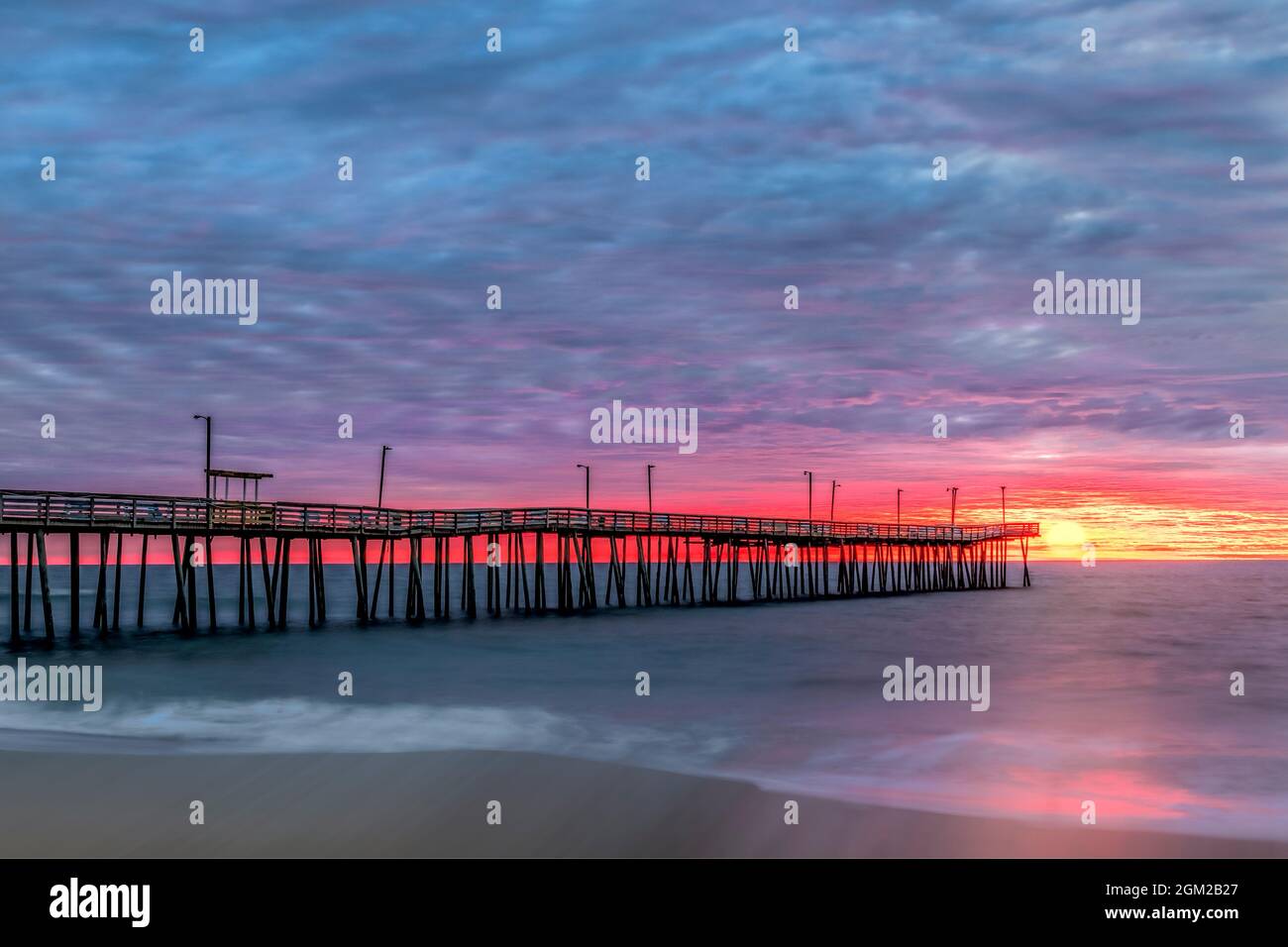 Virginia Beach Pier - The sun rises at the Virginia Beach Fishing Pier ...