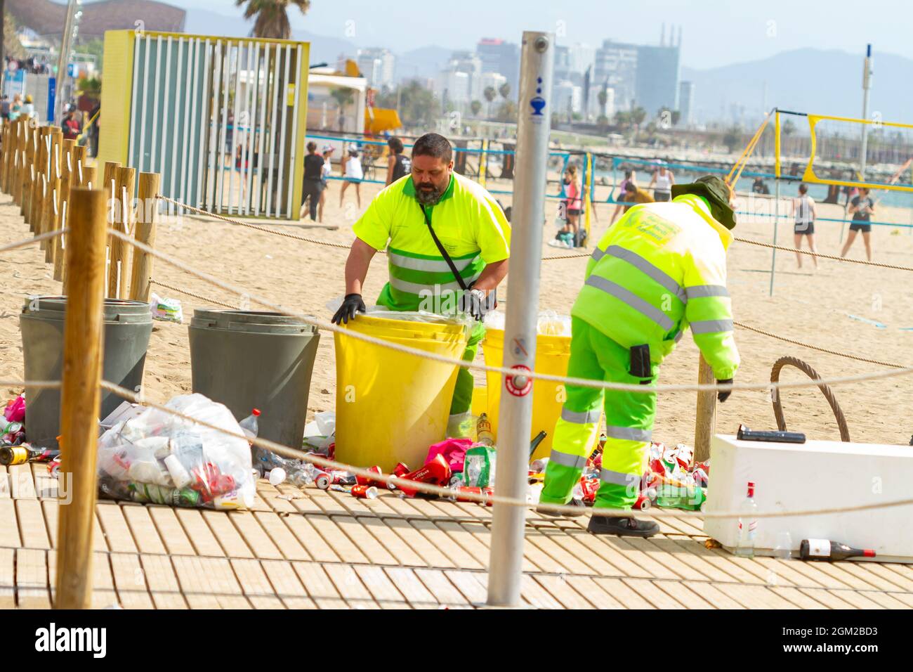 BARCELONA, SPAIN - May 05, 2021: The beach cleanup workers cleaning ...