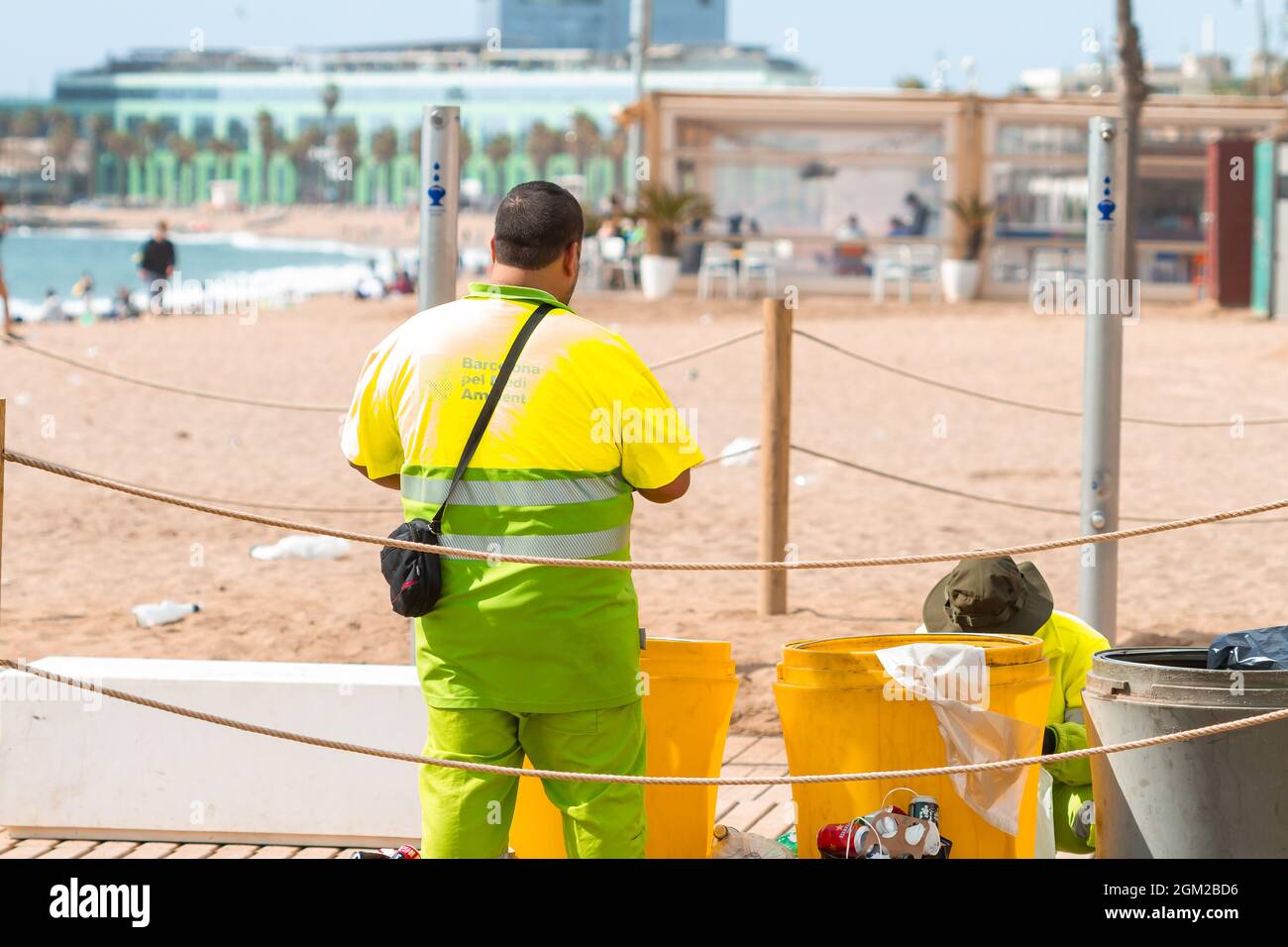BARCELONA, SPAIN - May 05, 2021: The beach cleanup workers cleaning ...