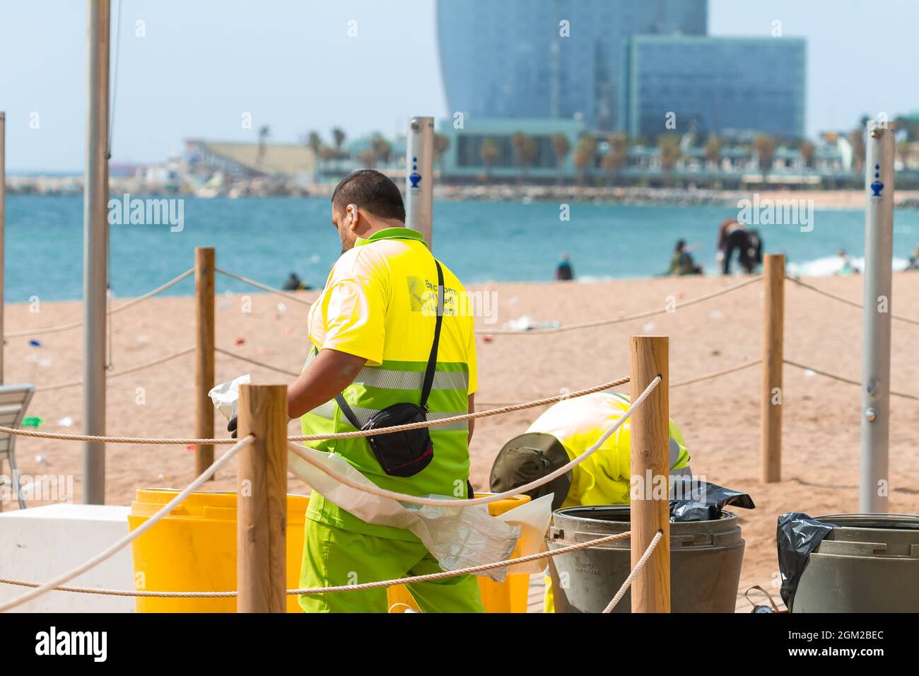 BARCELONA, SPAIN - May 05, 2021: The beach cleanup workers cleaning ...