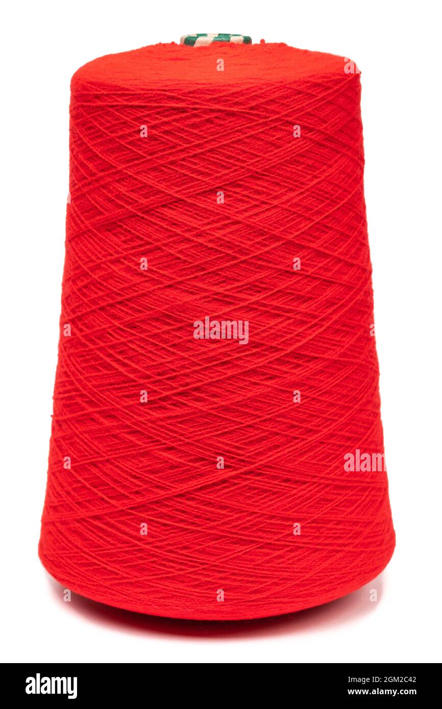 Cone of red color synthetic or wool threads isolated on white ...