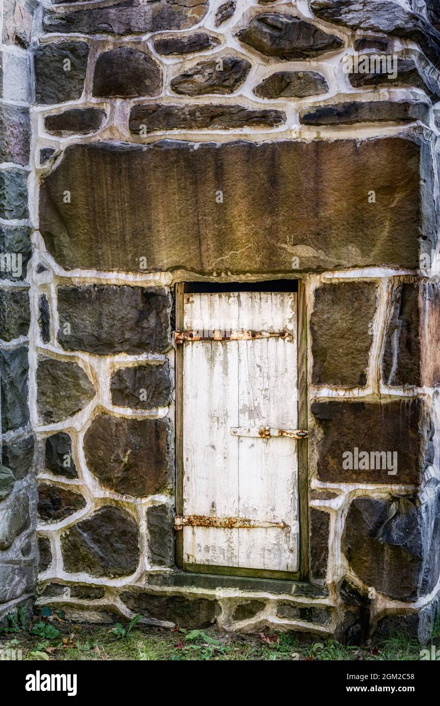 Wood And Stone - An old wooden door and hinges in a stone structure ...