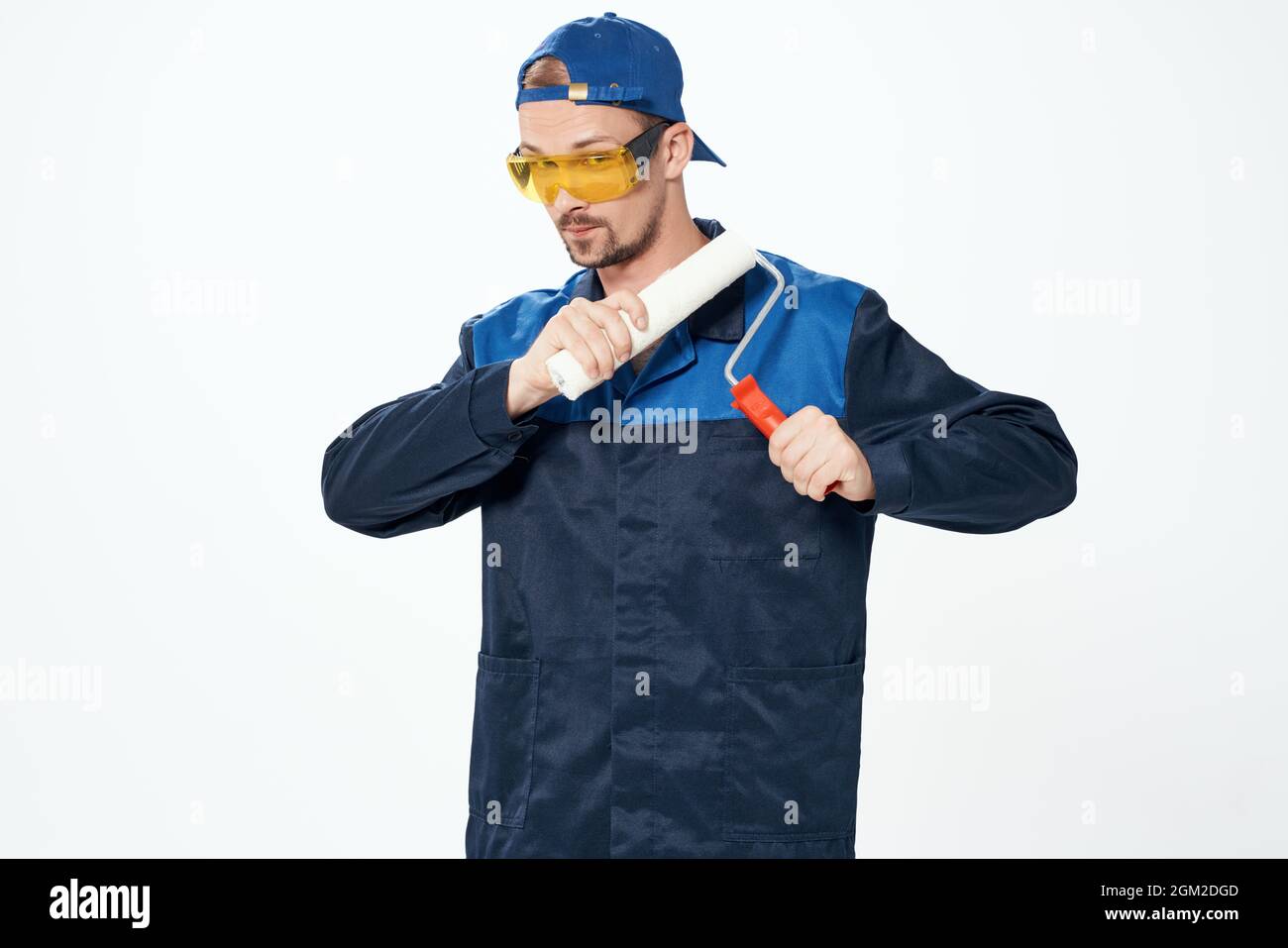 man in working uniform repair painting decorator Stock Photo - Alamy