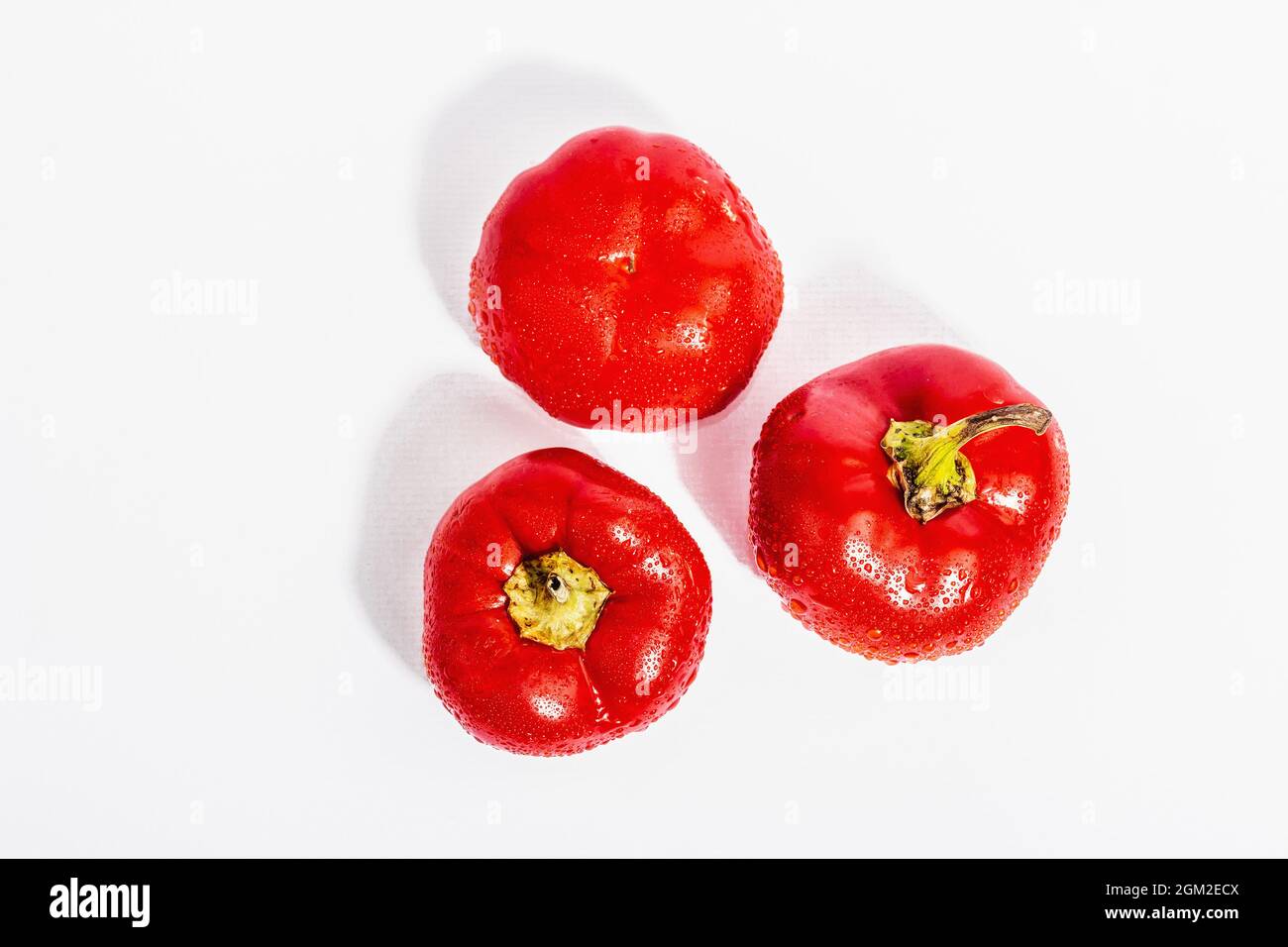 Ripe red round peppers isolated on white background. Fresh vegetables ...